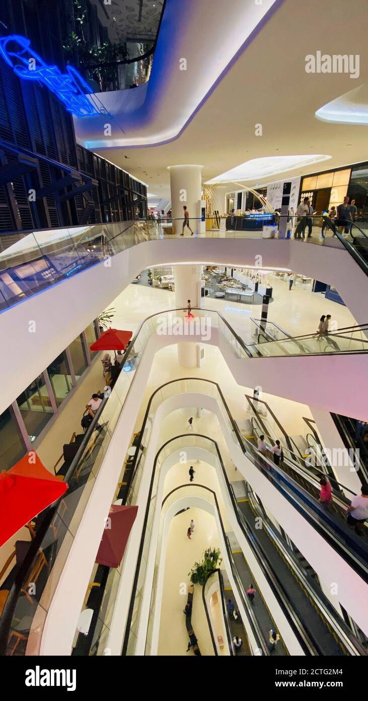 Multil level shopping mall with shoppers Stock Photo - Alamy