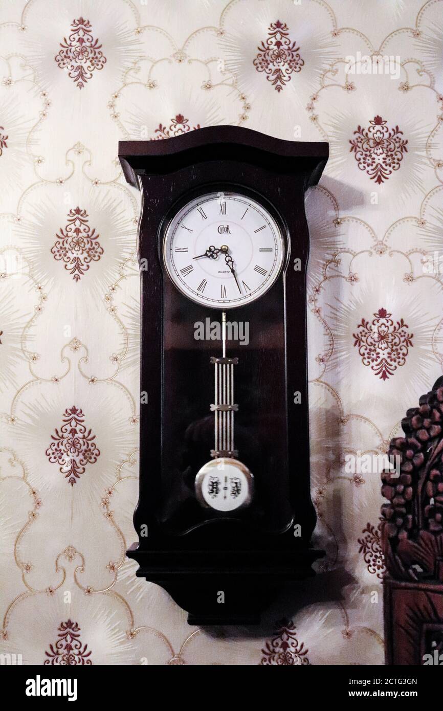 Black Old clock on the wall, vintage Stock Photo - Alamy