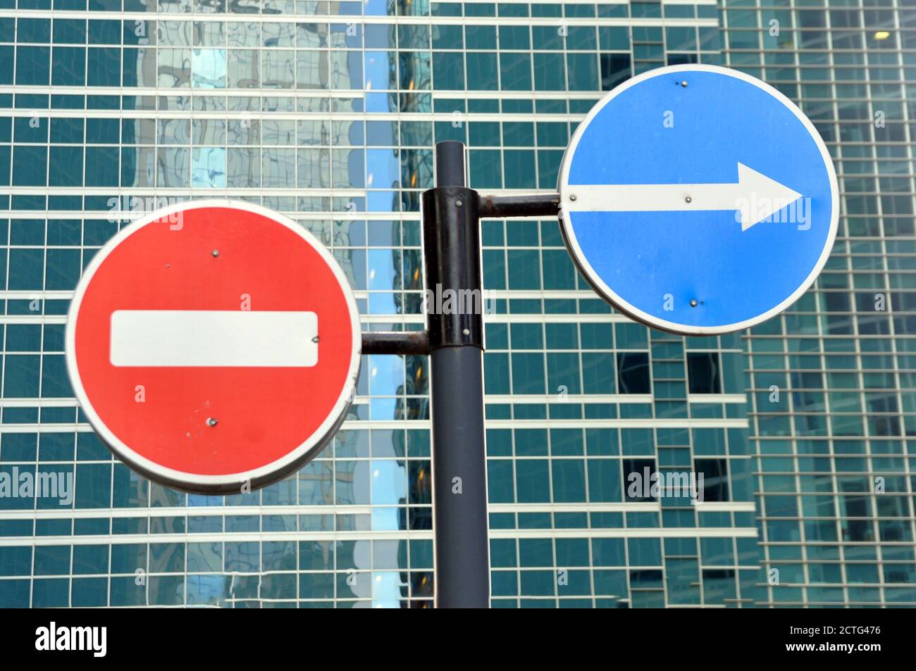 no entry and arrow to the right traffic sign in modern city ...