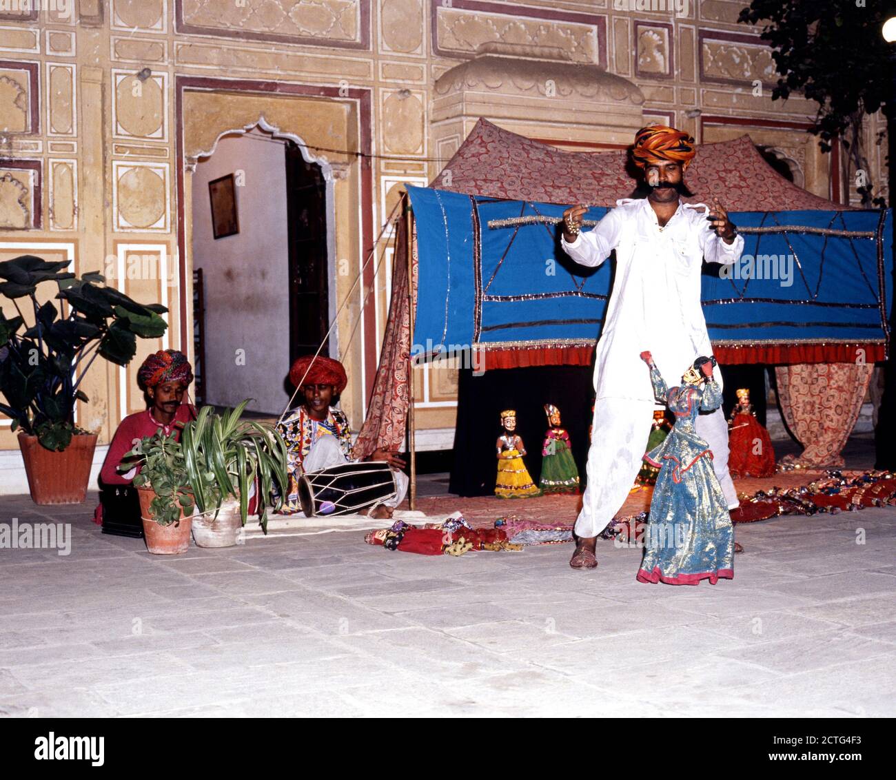 Pupeteer in traditional Indian clothing performing at the Samode Palace ...
