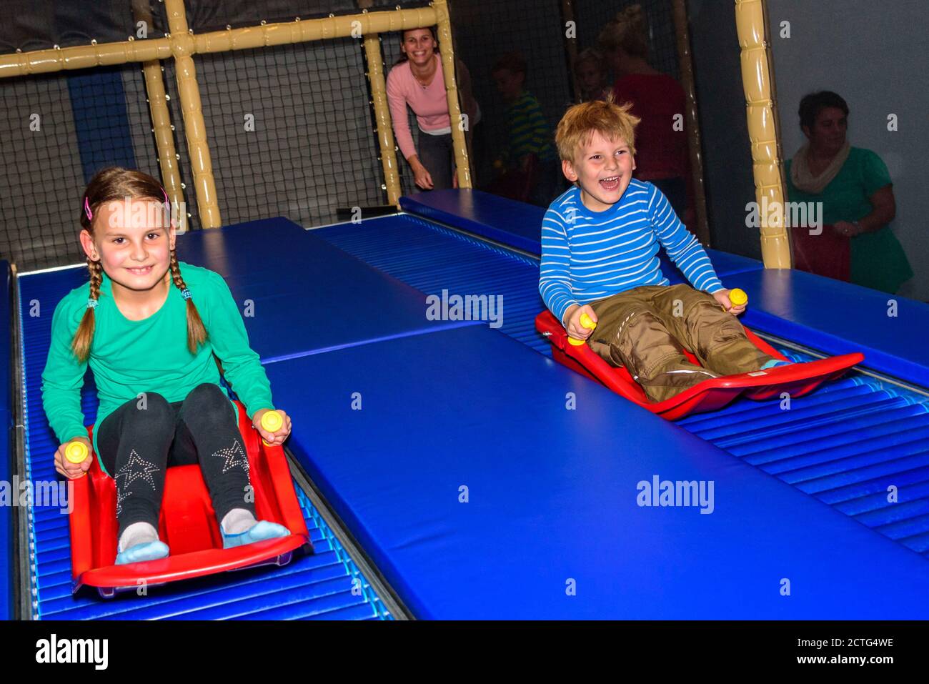 Funny afternoon at indoor playground Stock Photo - Alamy