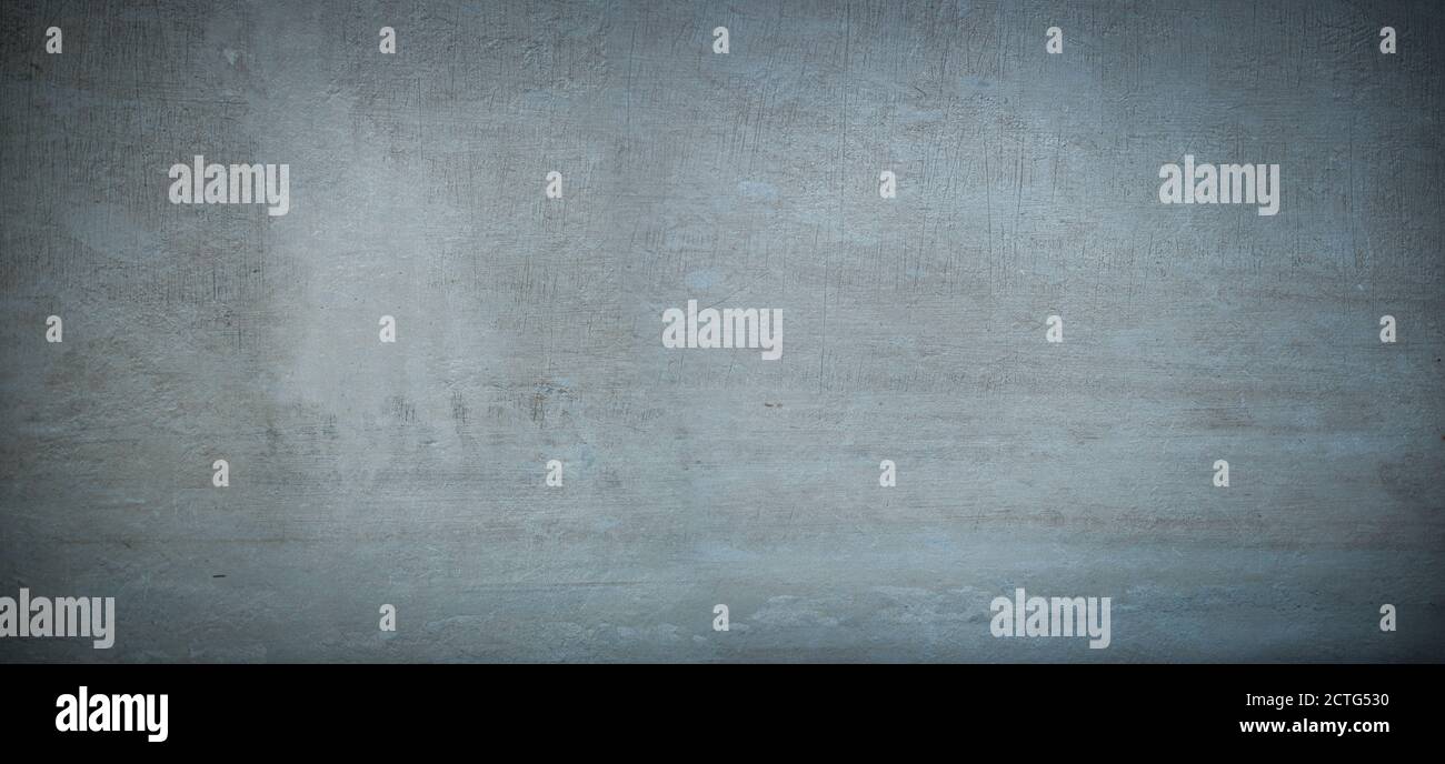 scratched old vintage smooth concrete stone background with blue tint ...