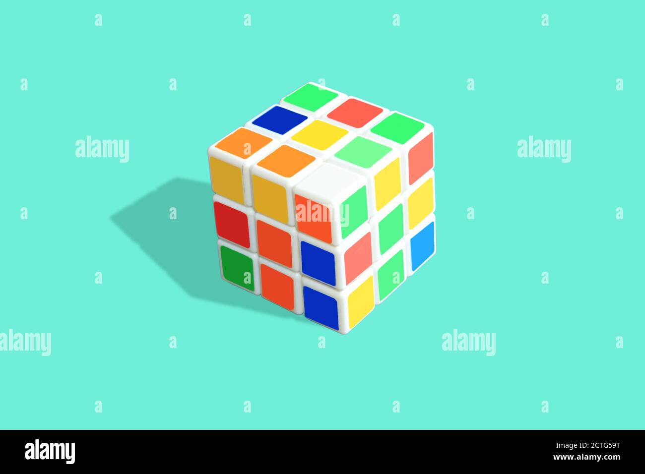 Rubik's cube isolated on blue background Stock Photo - Alamy