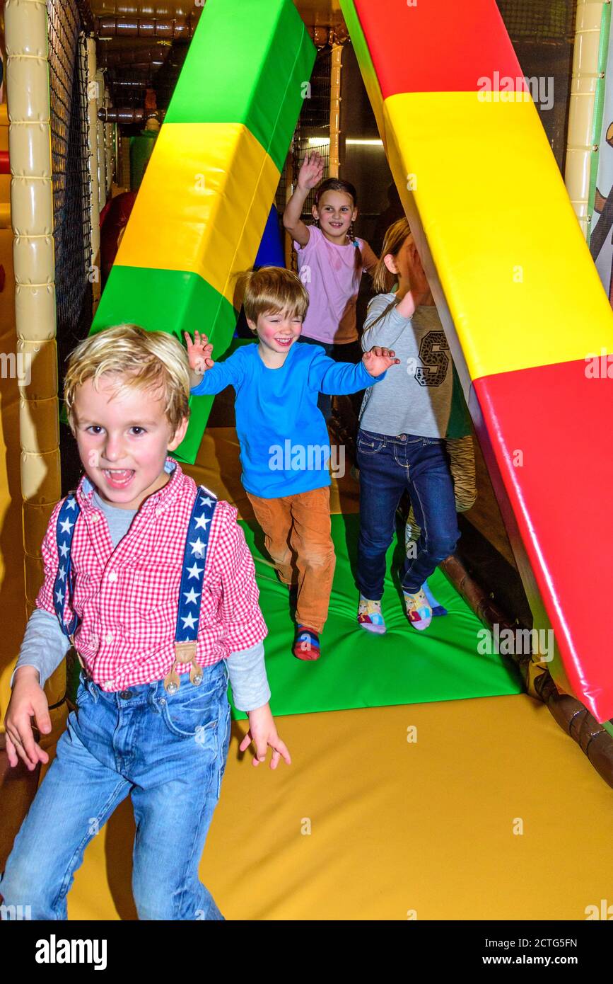 Funny afternoon at indoor playground Stock Photo - Alamy