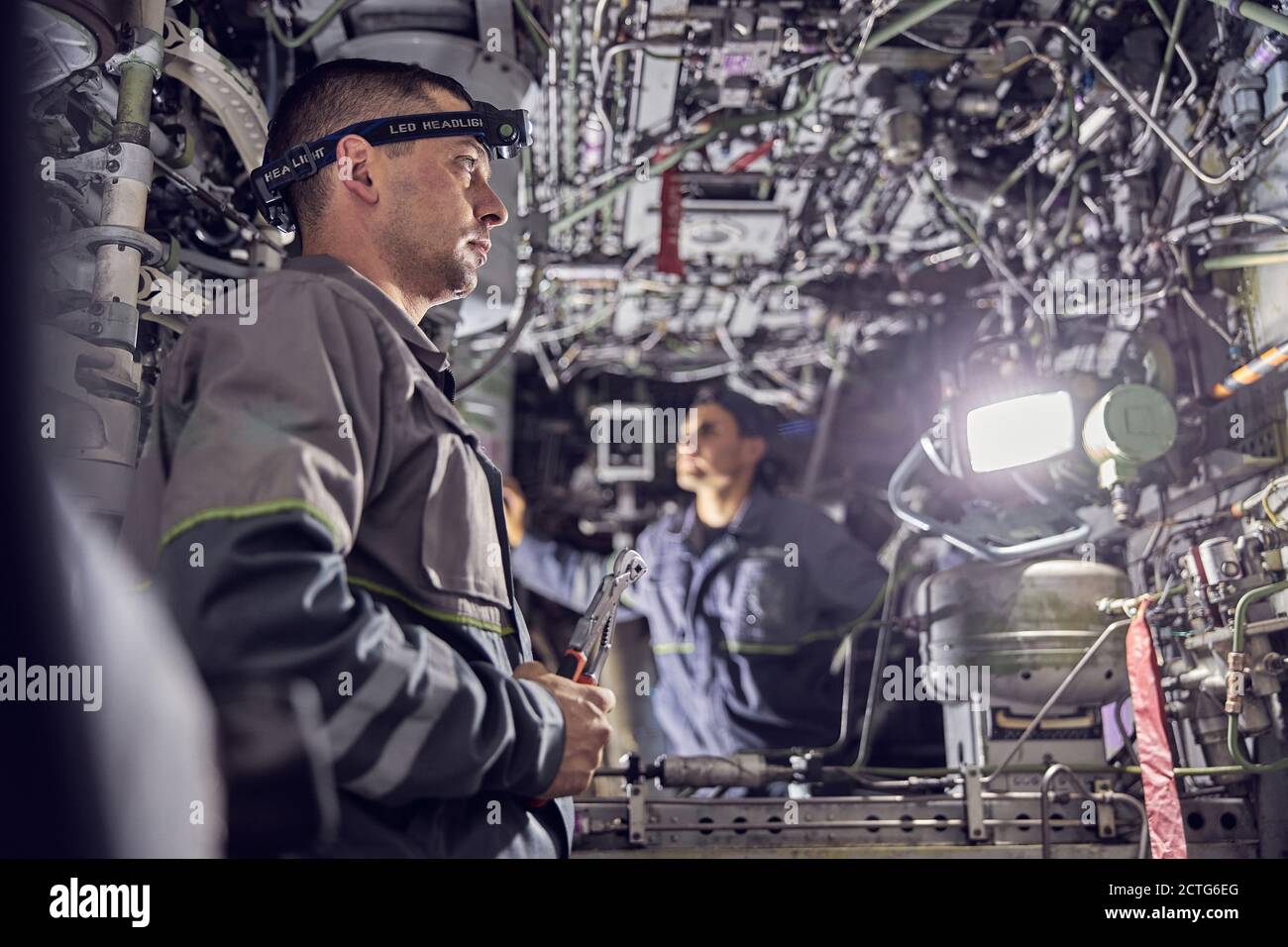 Side view portrait of two confident engineer working with electrical ...