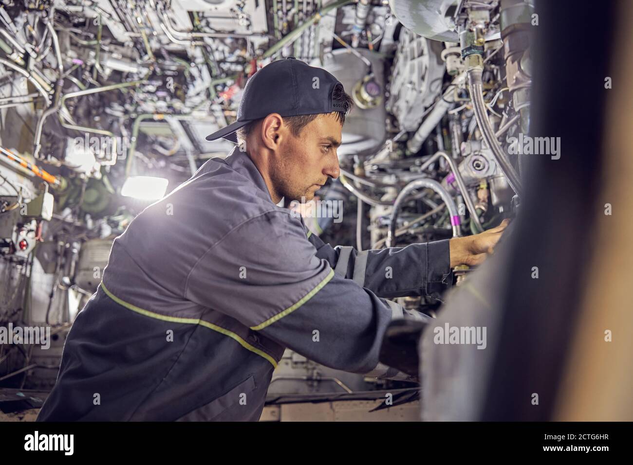 Side view portrait of handsome confident engineer in special uniform ...