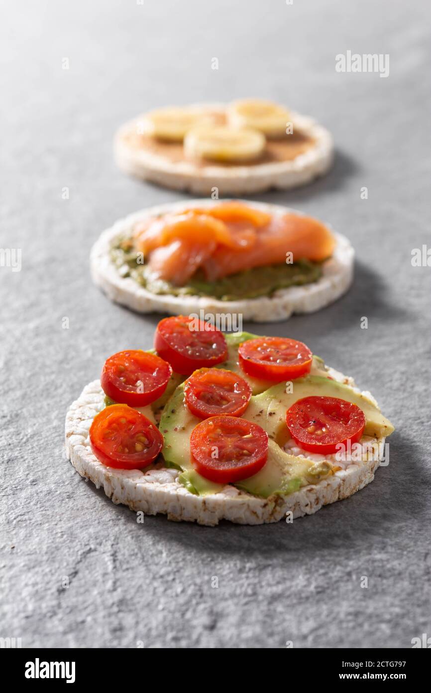 Assortment Puffed rice cake snack on gray stone Stock Photo - Alamy