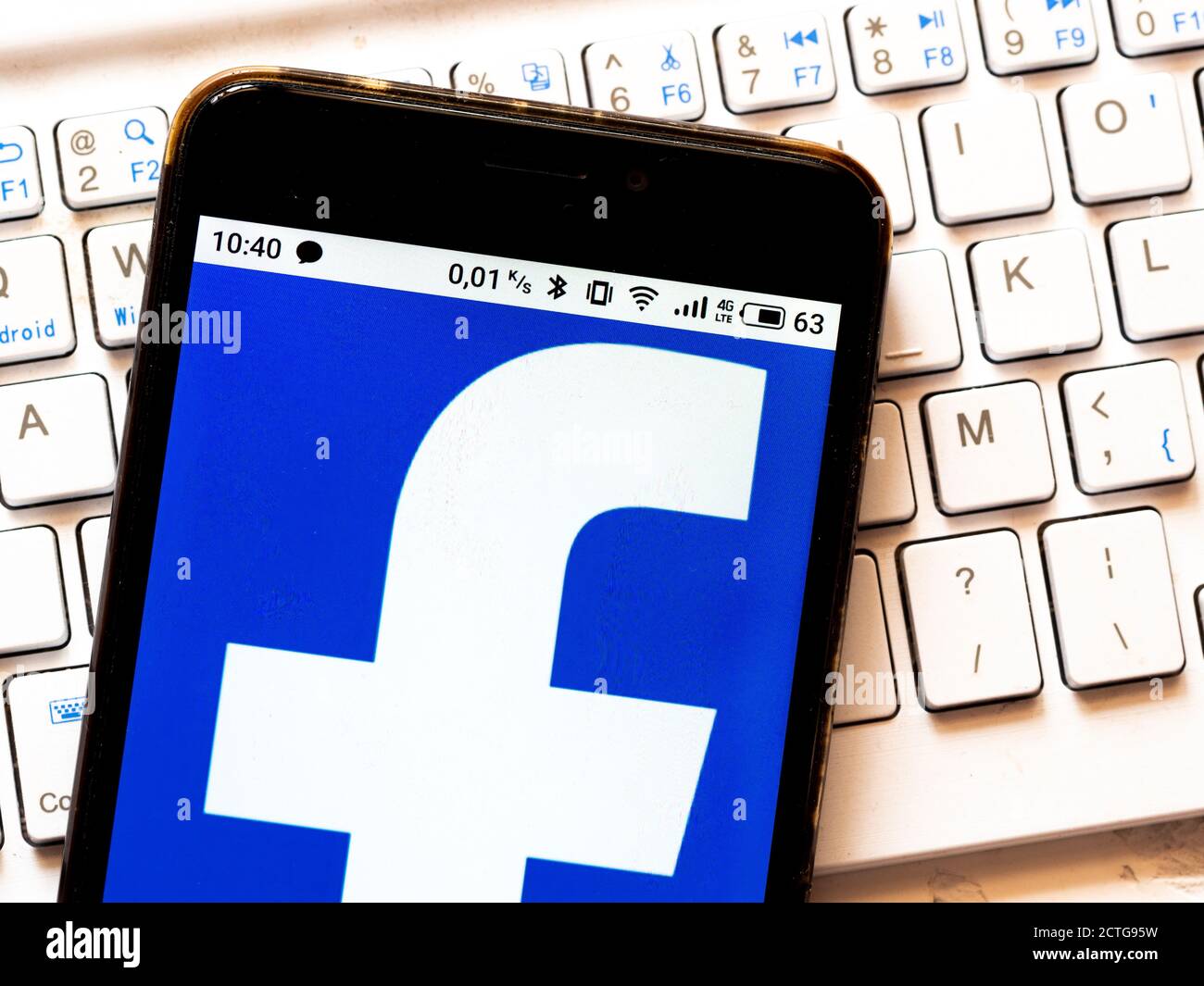 In this photo illustration a Facebook logo is seen displayed on a ...