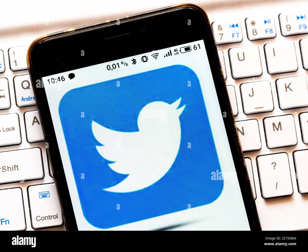 In this photo illustration a Twitter logo is seen displayed on a ...