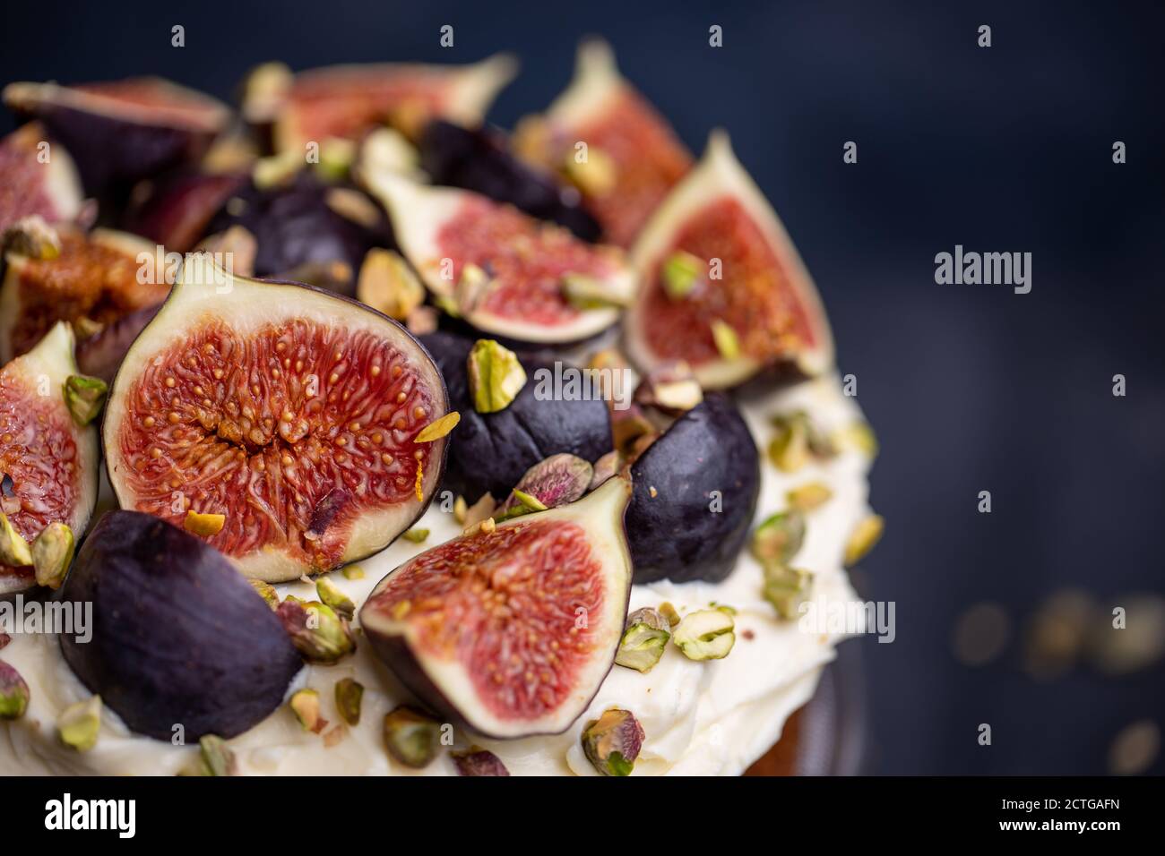Persian fig cake with fresh fruit, cream and pistachios Stock Photo - Alamy