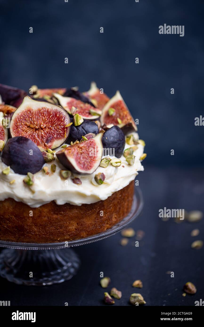 Persian fig cake with fresh fruit, cream and pistachios Stock Photo - Alamy