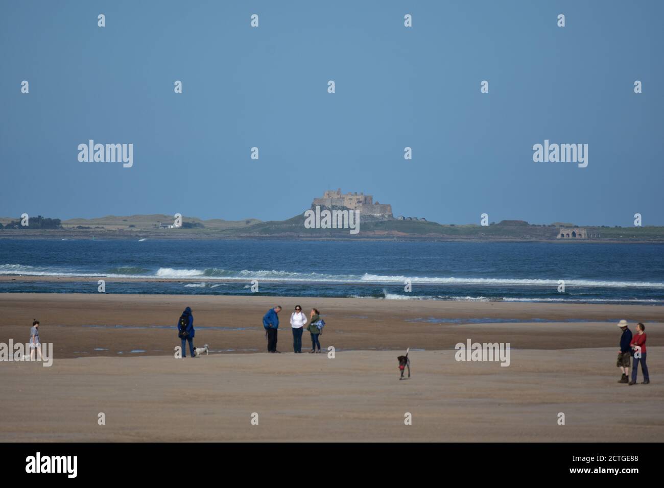 People on the beach in Autumn sunshine, Budle bay, Northumberland Stock ...