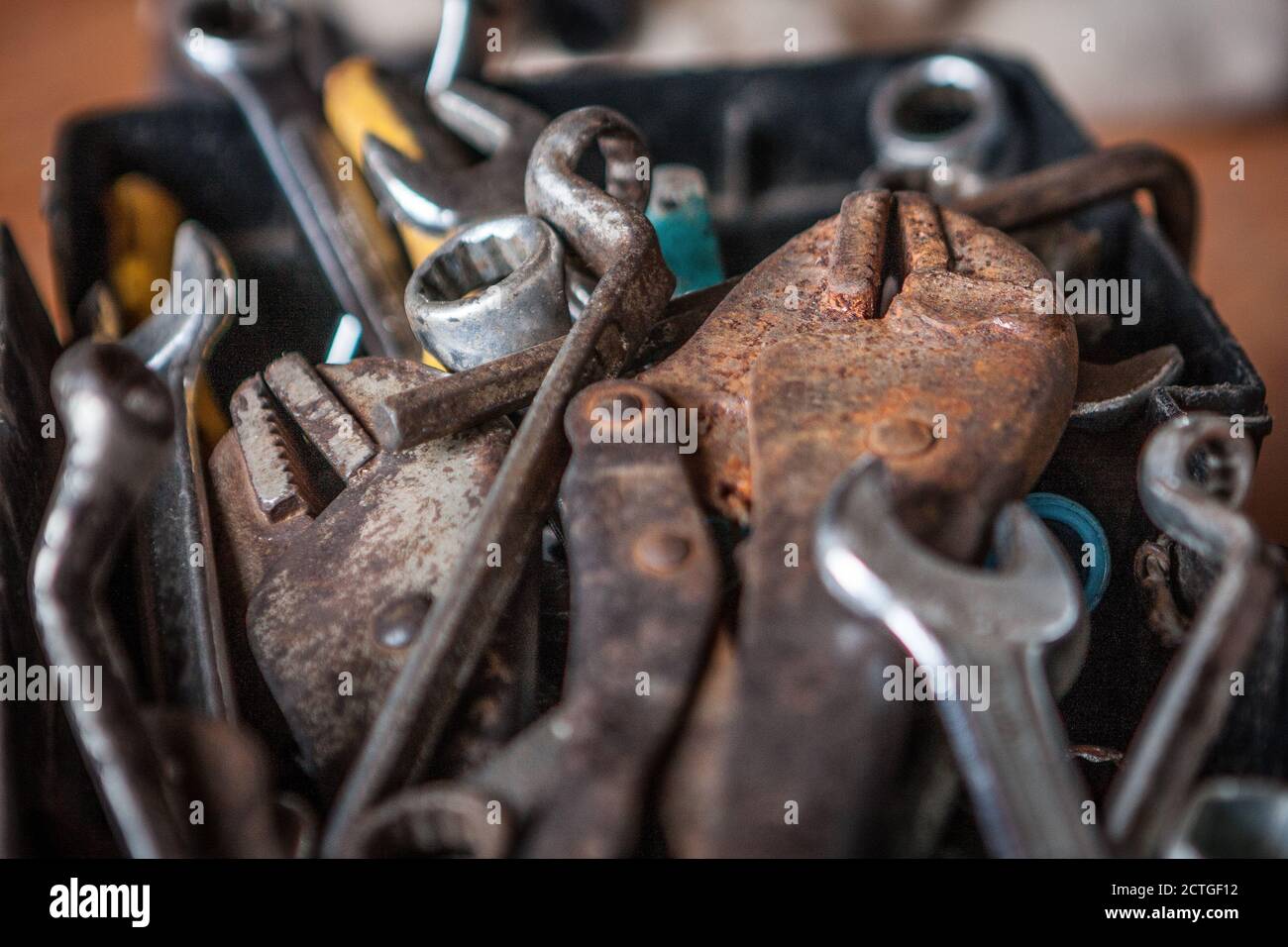 Locking pliers and wrench in tool box texture background Stock Photo ...