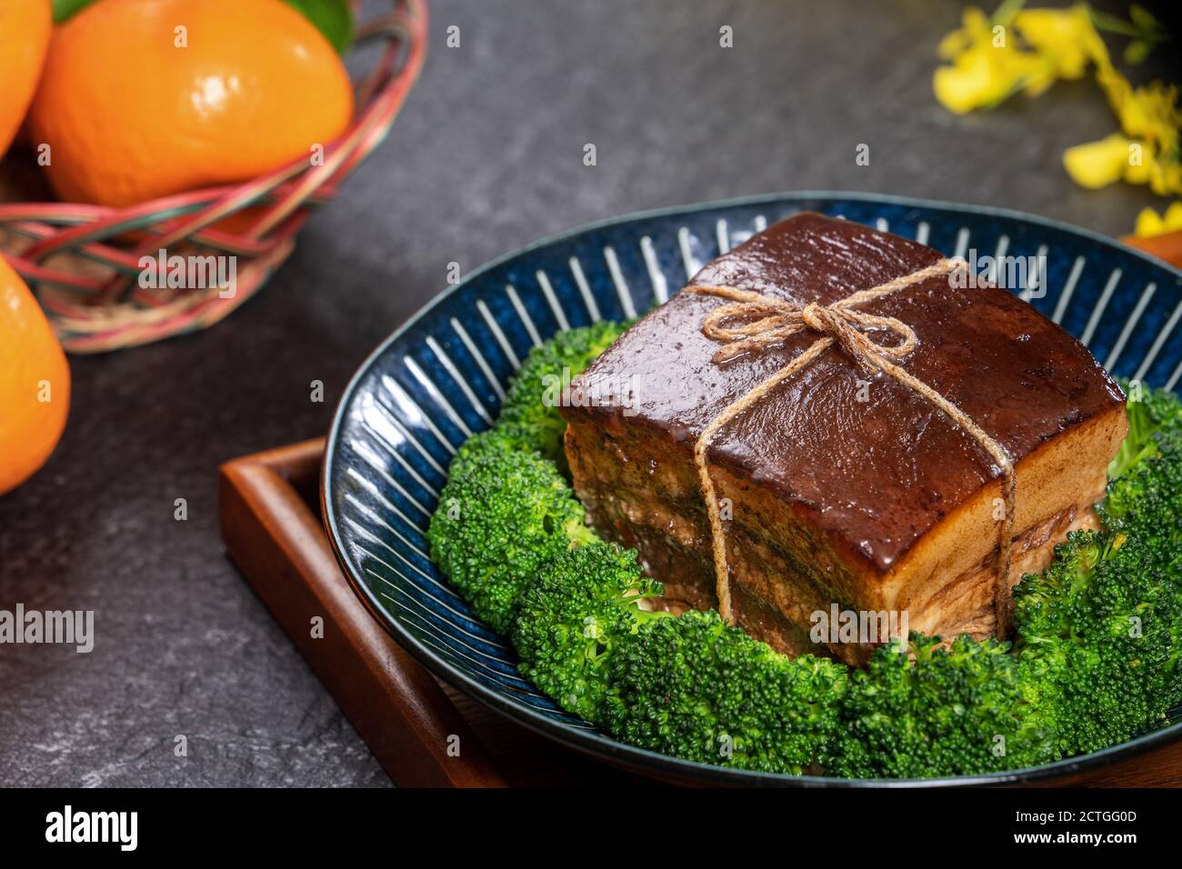 Dong Po Rou (Dongpo pork meat) in a beautiful plate with green broccoli ...