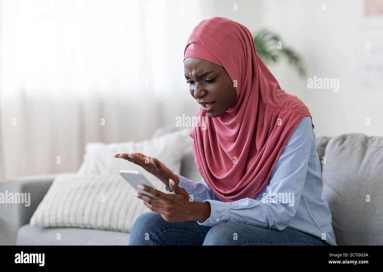 Bad Message. Annoyed Black Muslim Woman In Hijab Shouting On Cellphone ...
