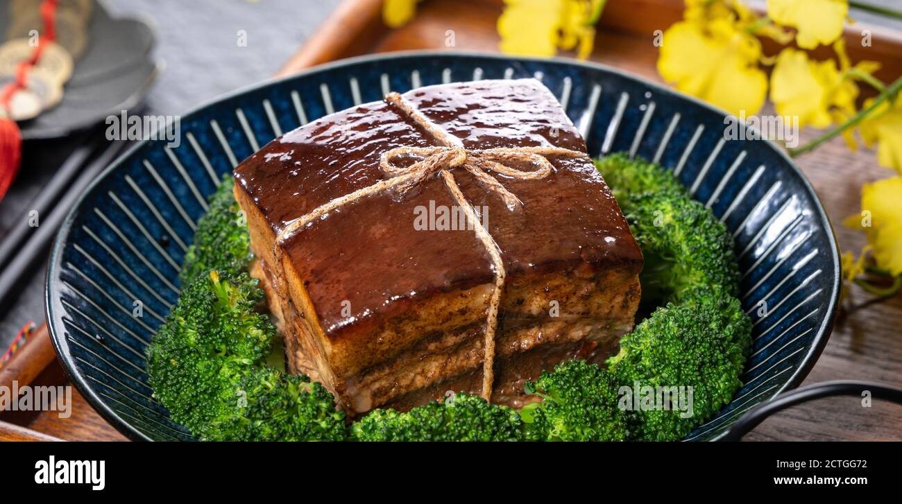 Dong Po Rou (Dongpo pork meat) in a beautiful plate with green broccoli ...