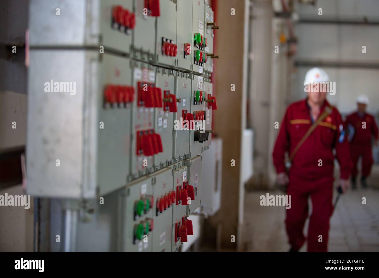 Electric equipment panel and remote control (console). Refinery workers ...