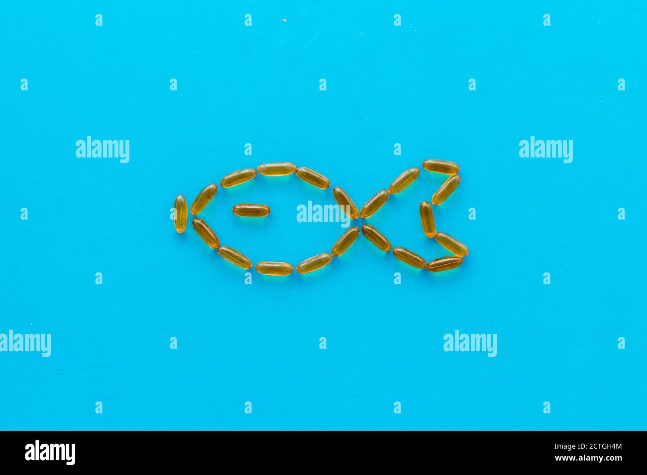 Omega3 capsules cod liver oil, fish shape. Top view Stock Photo - Alamy