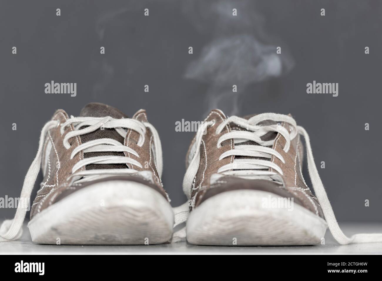 Dirty Shoes with Smoke Stock Photo - Alamy