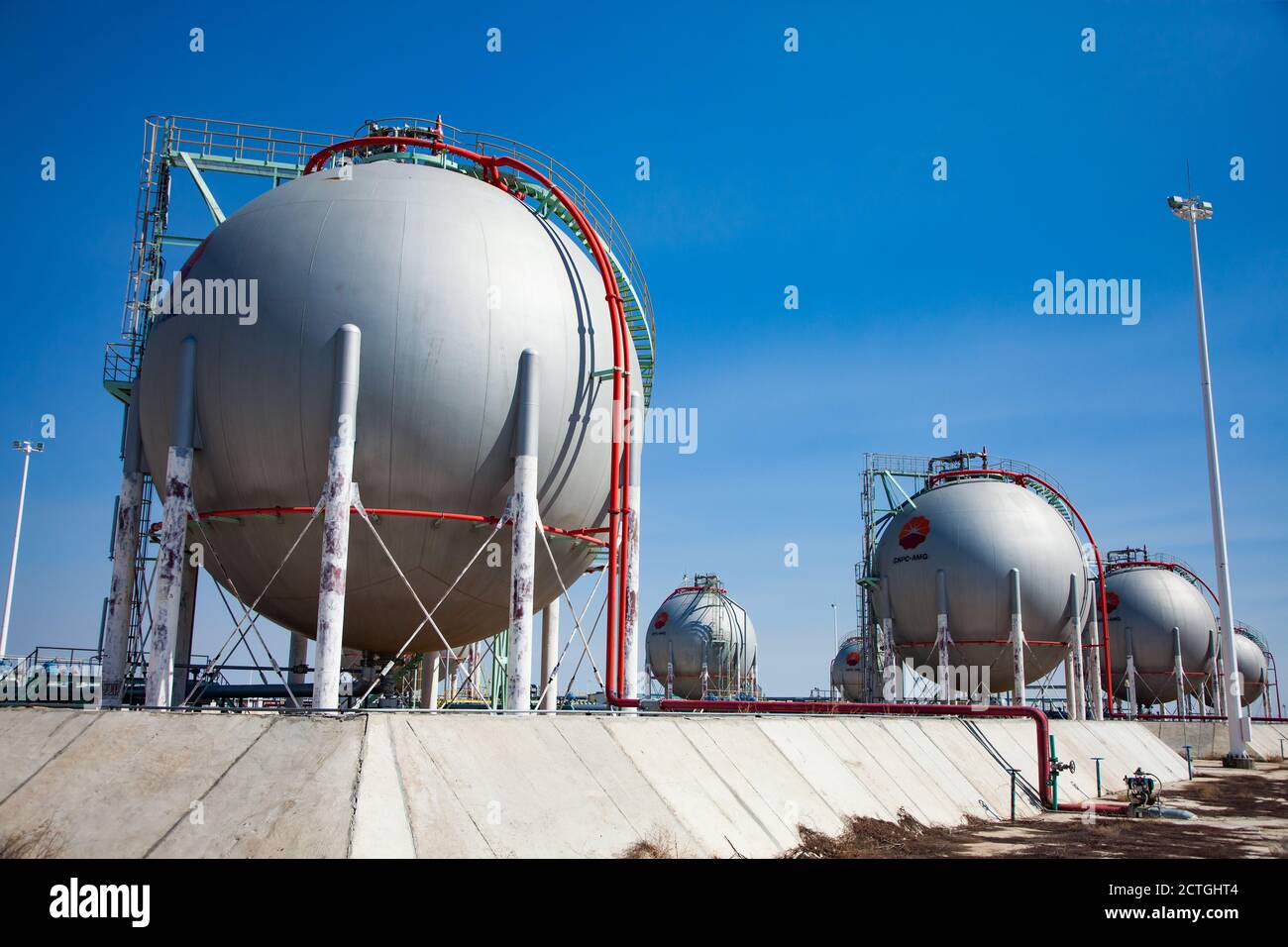 Aktobe region,Kazakhstan: Oil refinery plant in desert. Sphere gas ...