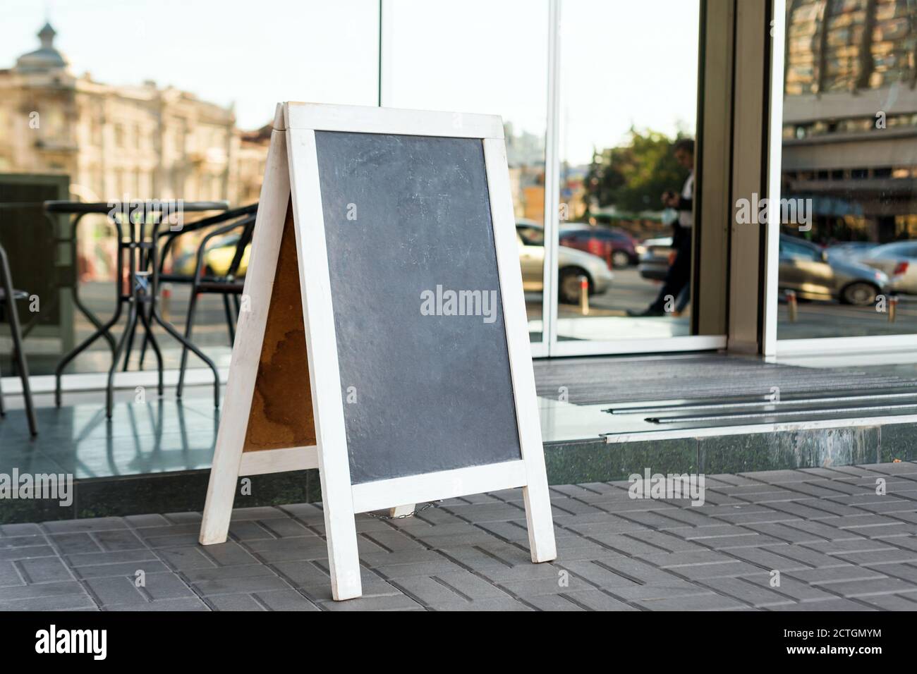 Signboard on the street. Empty menu board stand. Restaurant sidewalk ...