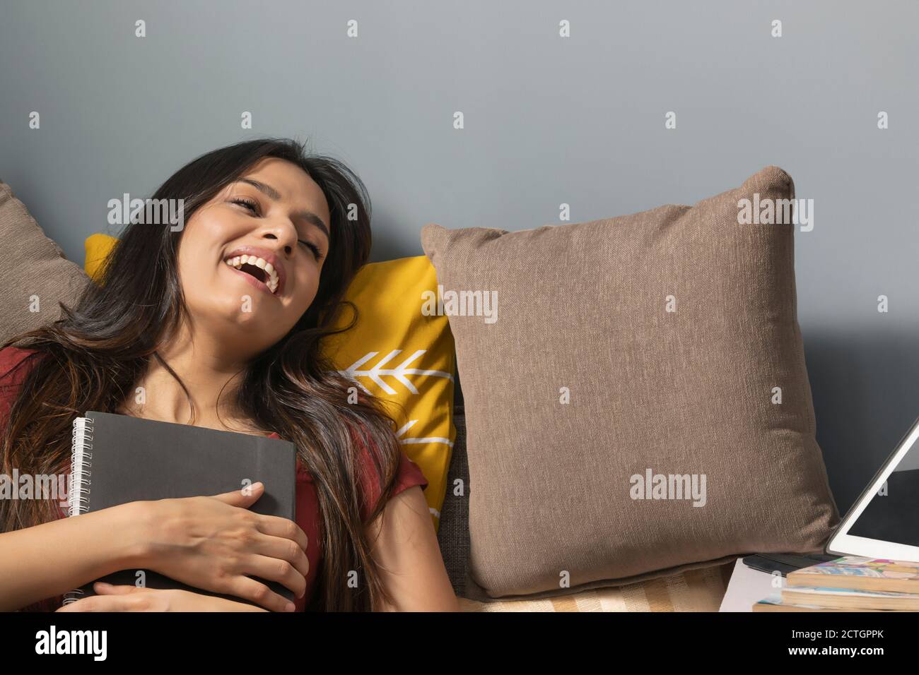 Woman laughing after reading hi-res stock photography and images - Alamy