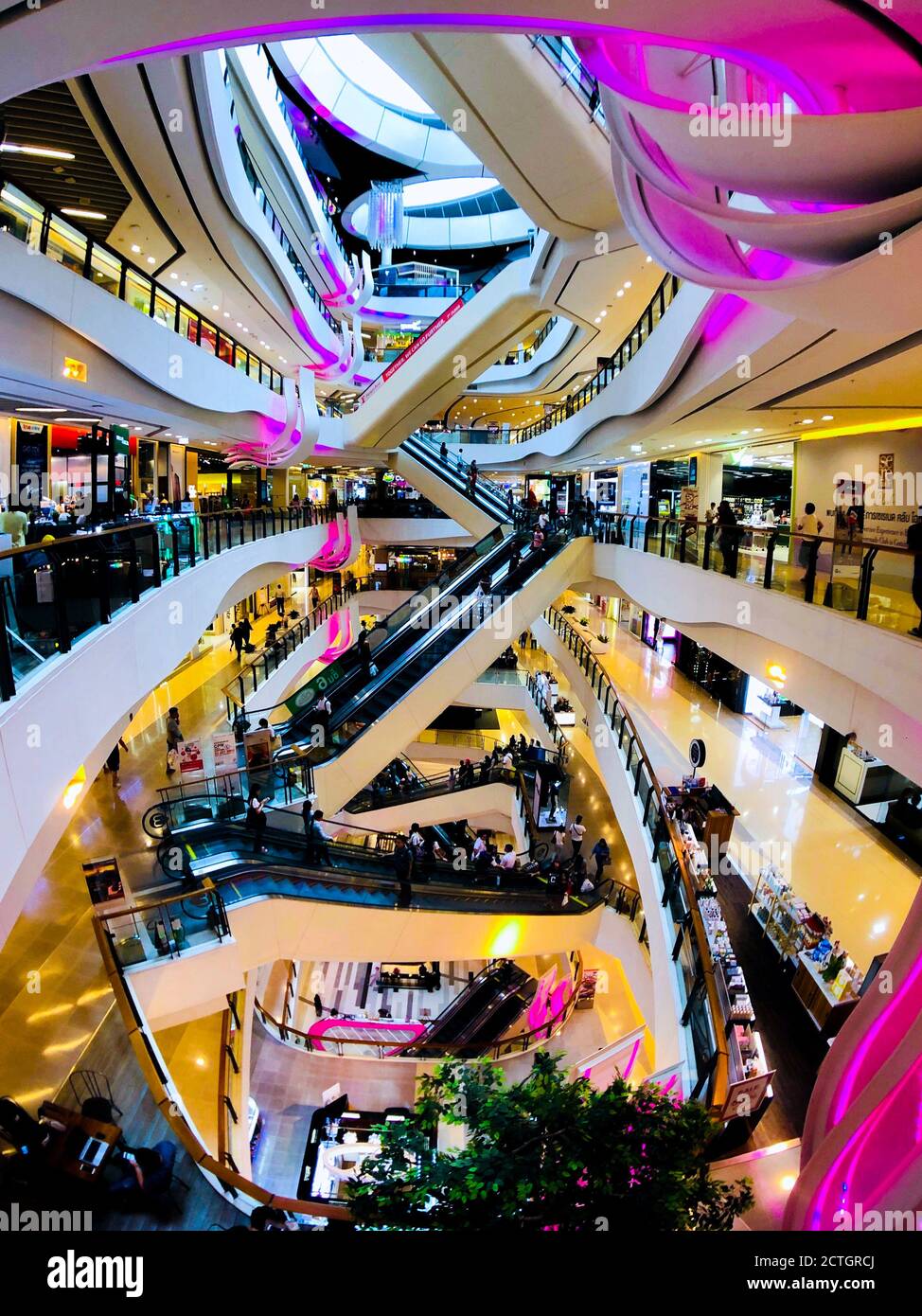 Shopping mall in pink light Stock Photo - Alamy