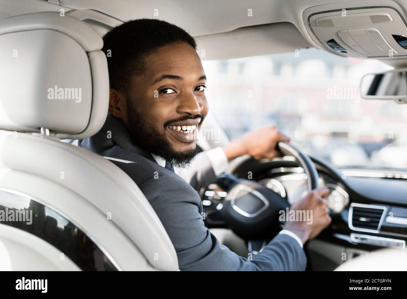 Happy African American Businessman Driving Smiling To Camera Stock ...