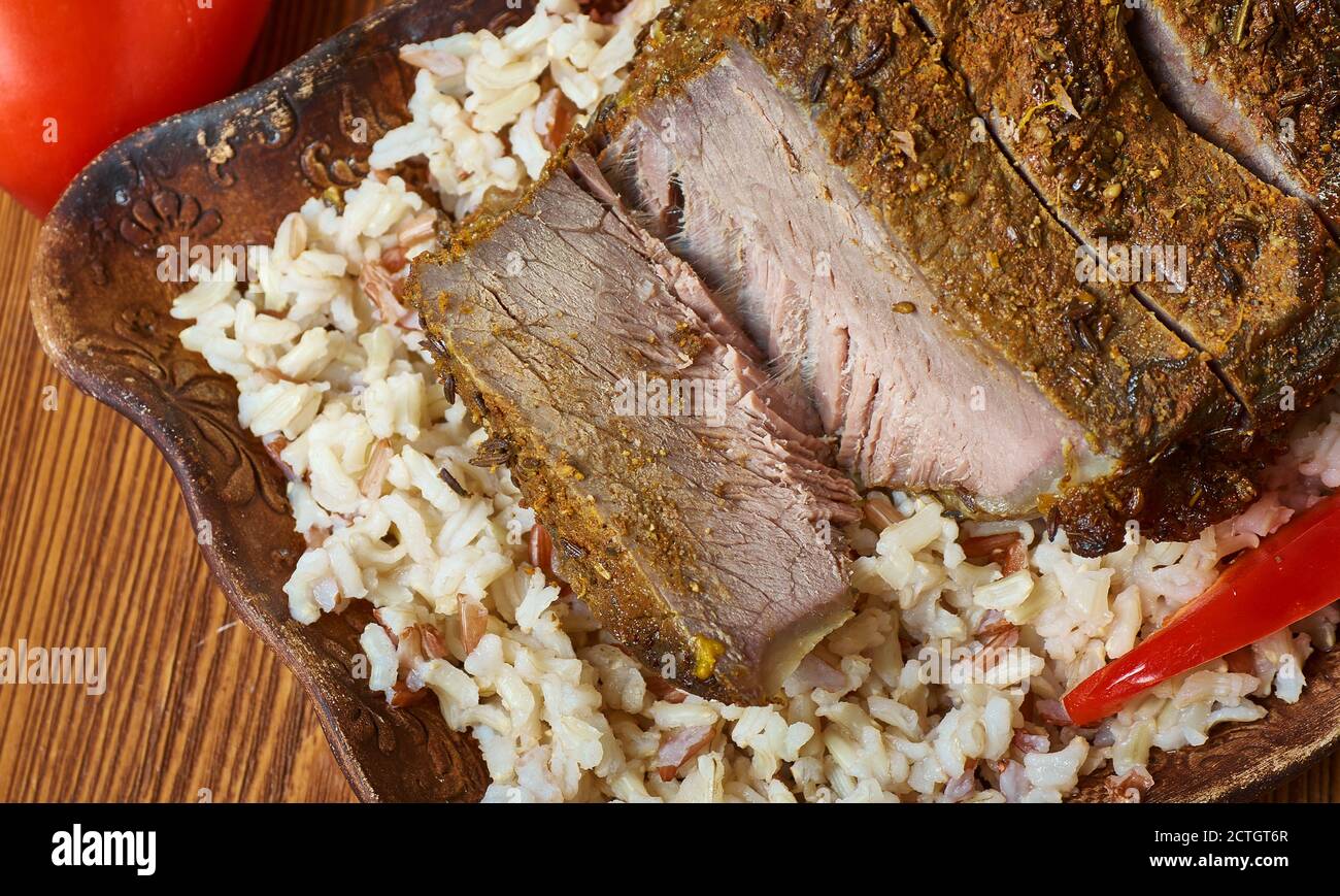 Shuwa - national dish of Oman, prepared with bone-in cuts of lamb or ...