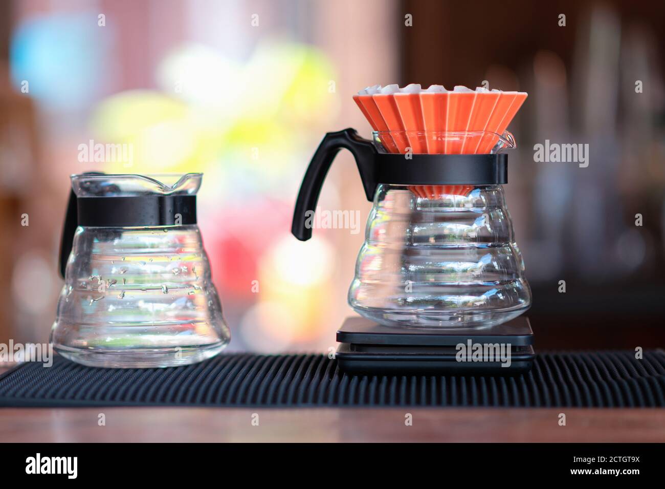 Coffee brewing gadgets on wooden bar counter Stock Photo - Alamy