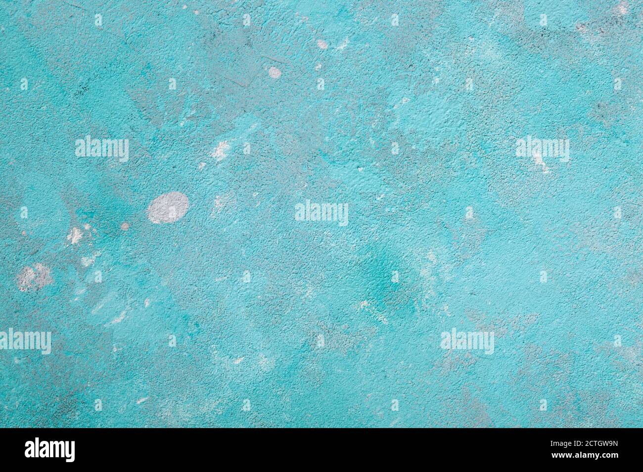 Concrete emerald green background with scuffs and black splashes ...