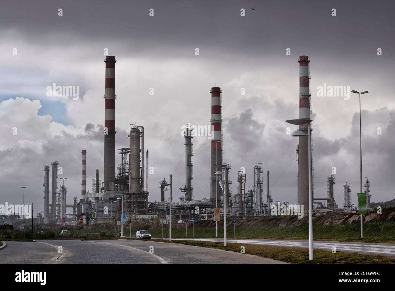 Big oil refinery flanked by a public road Stock Photo - Alamy