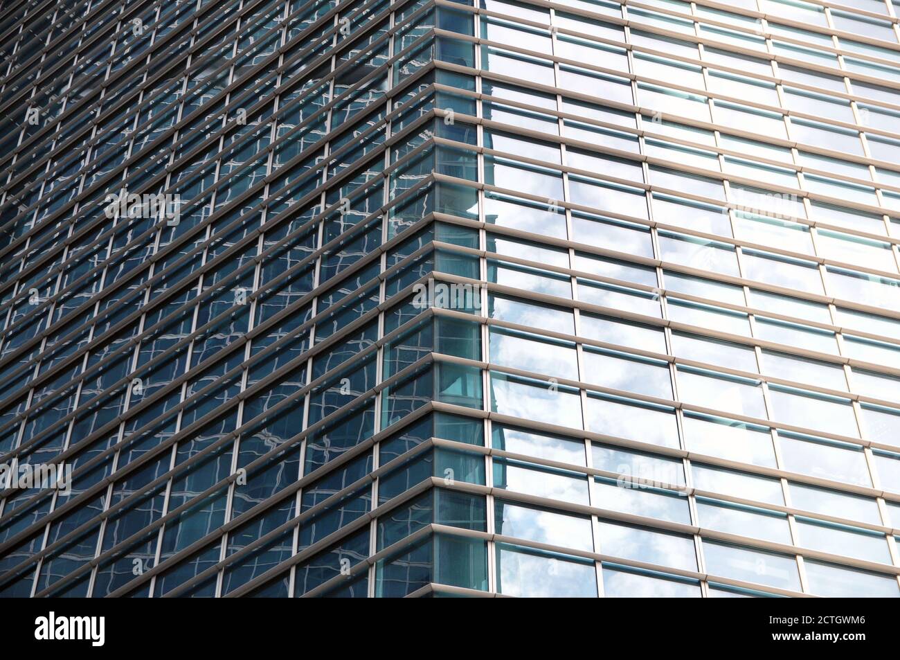Skyscraper facade with glass facade and reflections Stock Photo - Alamy