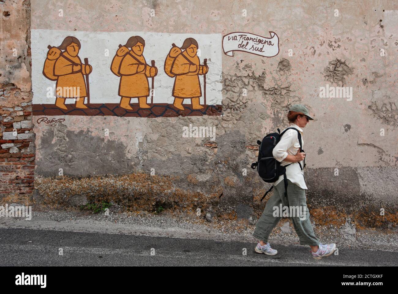 Pilgrim walking along the Via Francigena near Terracina, in the ...
