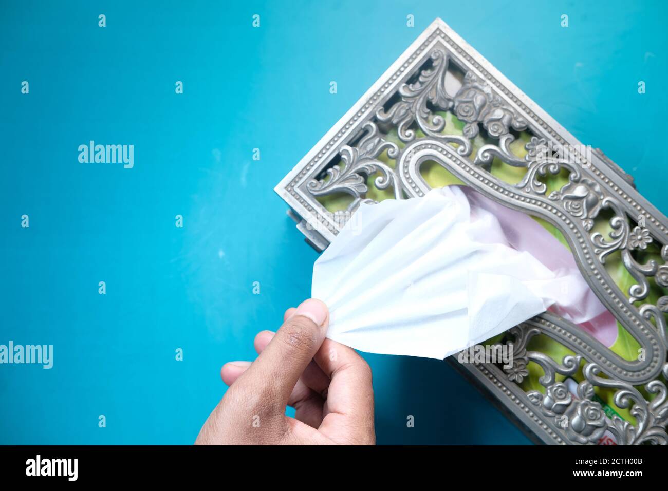Hand taking tissue hi-res stock photography and images - Alamy