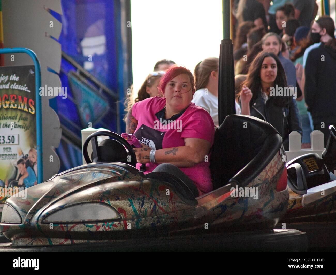 Driving a dodgem car on Brighton Pier Stock Photo - Alamy