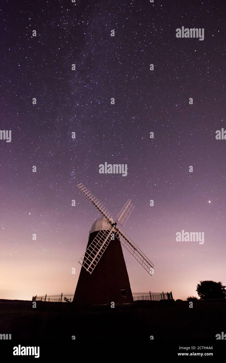 Halnaker windmill silhouetted against the night sky full of stars ...