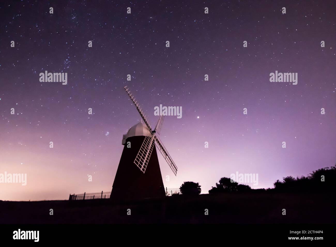 Halnaker windmill silhouetted against the night sky full of stars ...