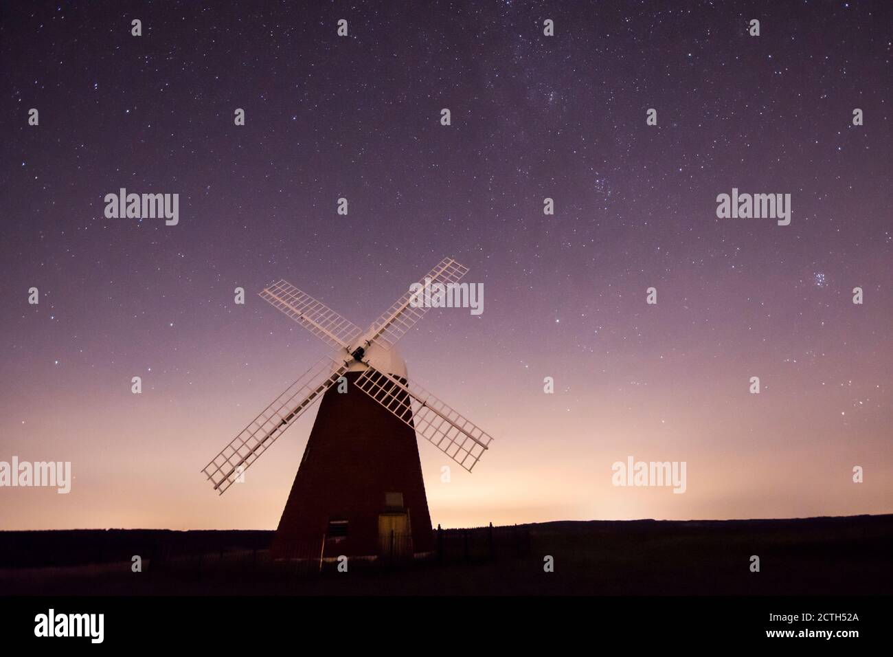 Halnaker windmill silhouetted against the night sky full of stars ...