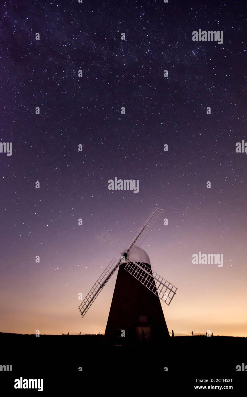 Halnaker windmill silhouetted against the night sky full of stars ...