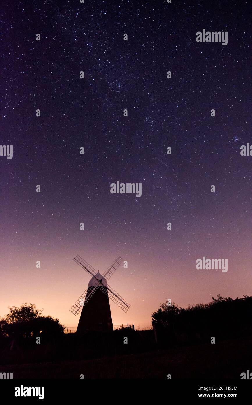 Halnaker windmill silhouetted against the night sky full of stars ...
