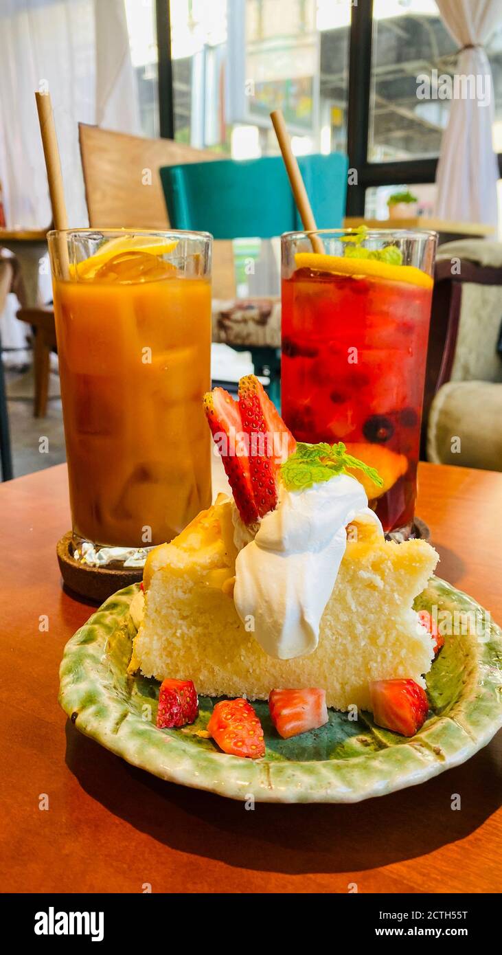 Cakes and drinks on café table Stock Photo - Alamy