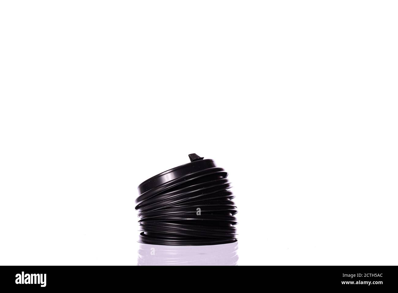 Stack of plastic disposable black top coffee caps isolated on white ...