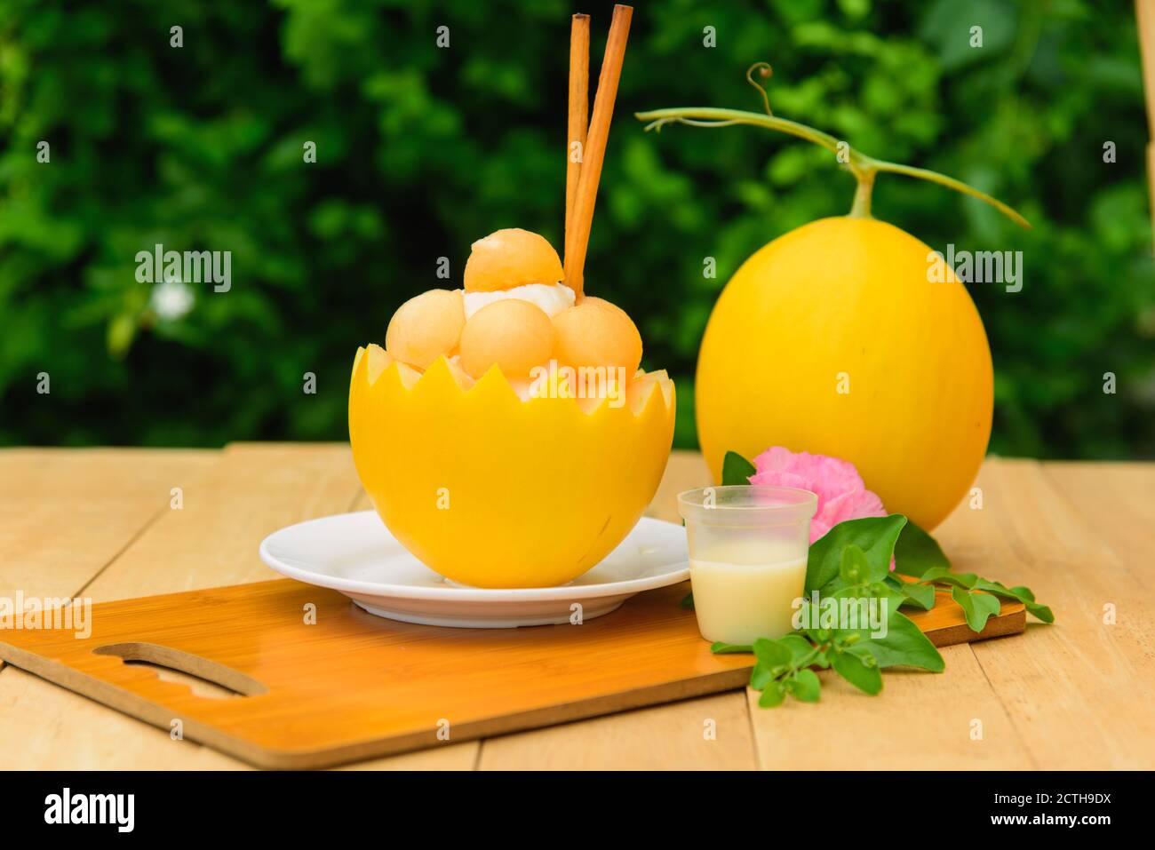 Melon Bingsoo with Sweetened Condensed Milk on wood table Stock Photo ...