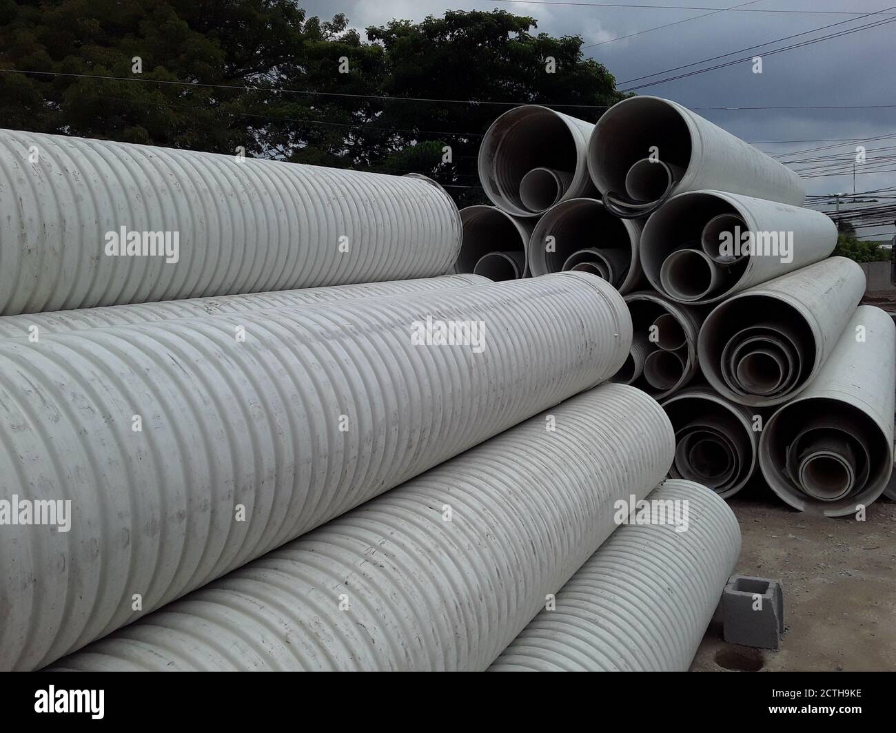 White metal pipes stacked on each other Stock Photo - Alamy
