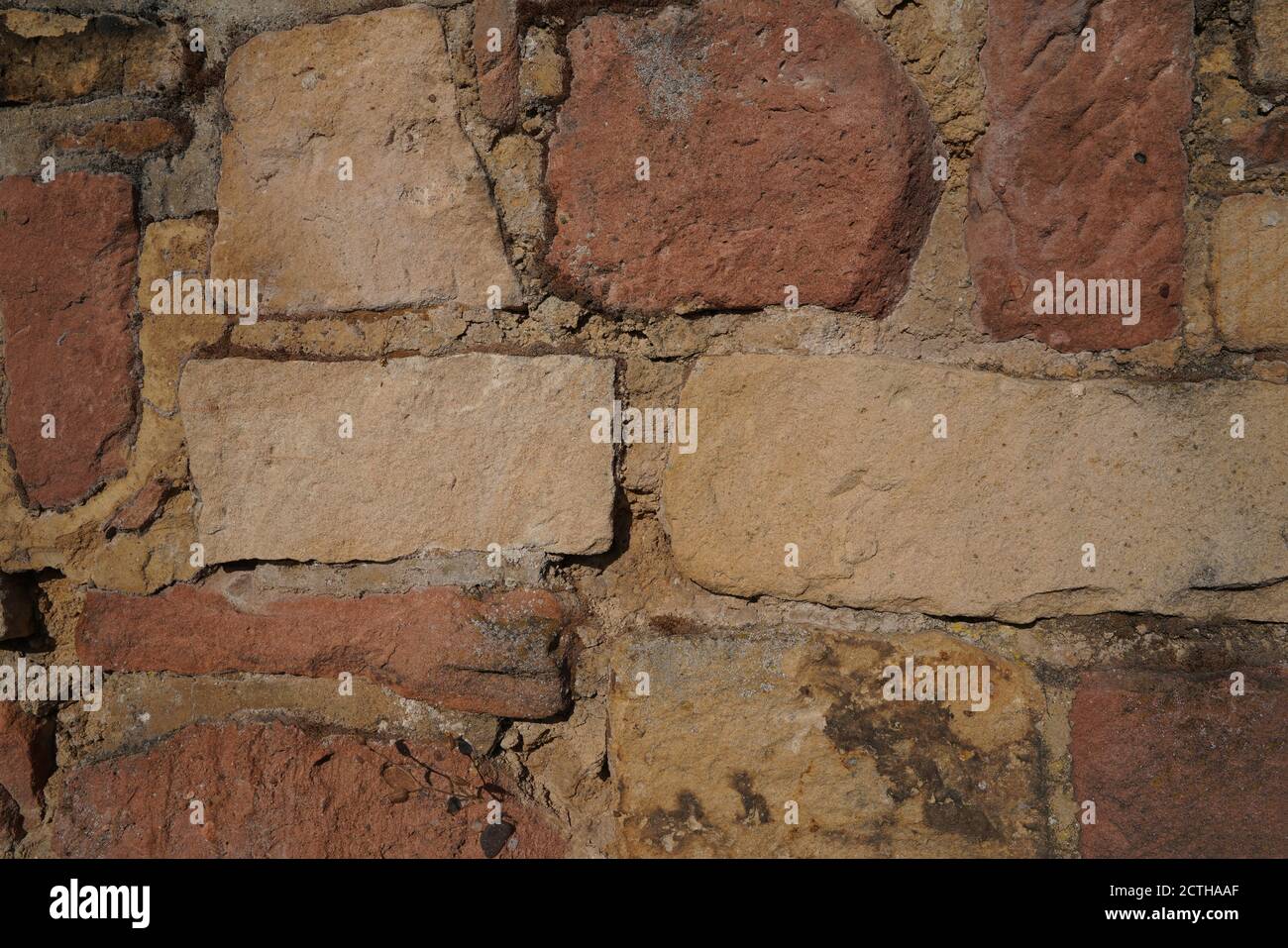 Background stone wall made of red stones Stock Photo - Alamy