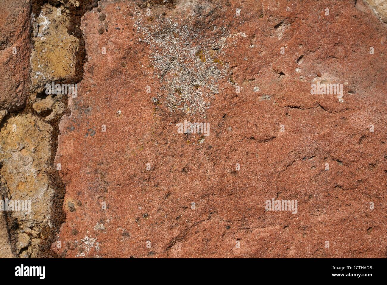Background stone wall made of red stones Stock Photo - Alamy