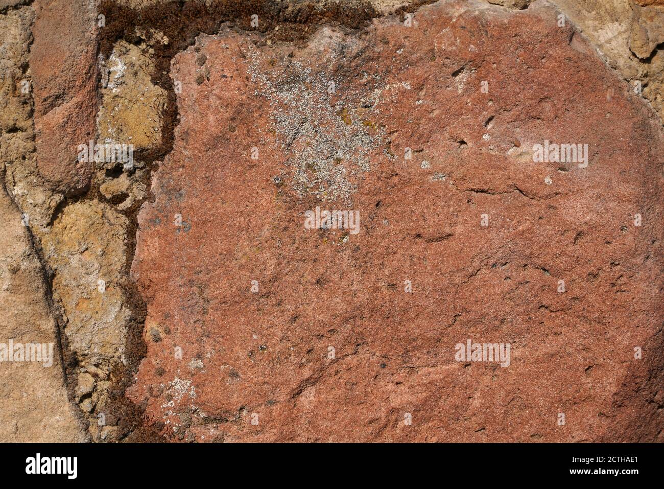 Background stone wall made of red stones Stock Photo - Alamy