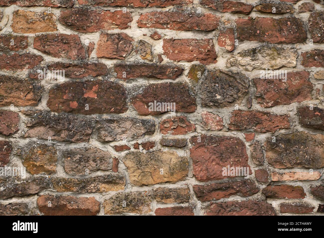 Background stone wall made of red stones Stock Photo - Alamy
