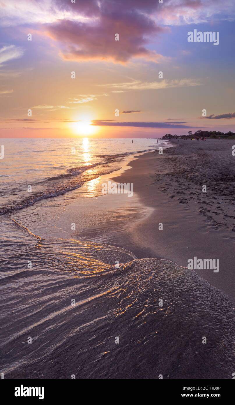 Summertime: beach sunset. Torre Mozza Beach is one of the longest and ...